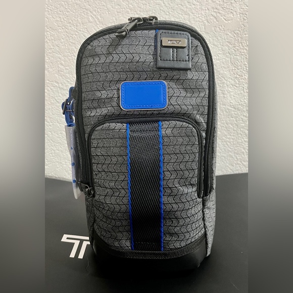 Tumi | Bags | Nwt Tumi Fife Slim Sling Bag Charcoal With Chevron Blue ...